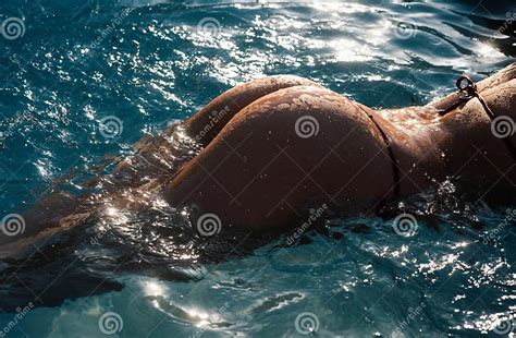 Curves Girl In Bikini In Pool Buttocks Young Woman Shows A Beautiful