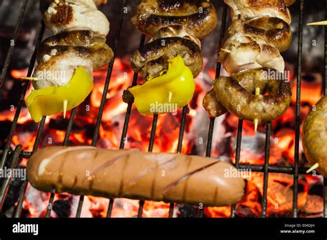 Different Types Of Meat Cooking Outside On A Barbecue Stock Photo Alamy