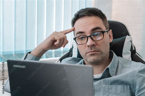 Thoughtful It Developer Thinking About Fixing Software Bugs On Netbook Contemplative Male