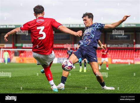 Kyle Joseph Of Blackpool Tackles Jamie Knight Lebel Of Crewe Alexander During The Pre Season