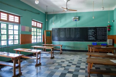Bright Classroom With Blackboard And Desks Premium Ai Generated Image