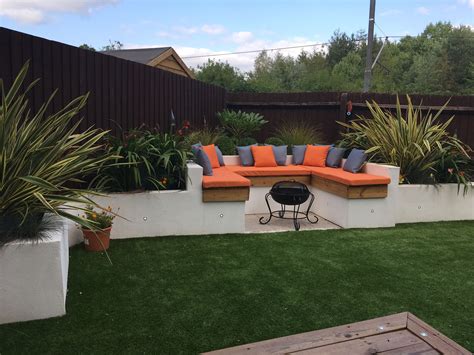 Outdoor Seating Area With Grass And Potted Plants