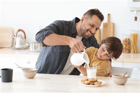 Favorite Morning Drink Happy Little Boy Helping His Father Pour Milk Glass Enjoying Healthy ...