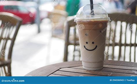 Cold Coffee In A Plastic Container With Smile Shape Design On It Stock