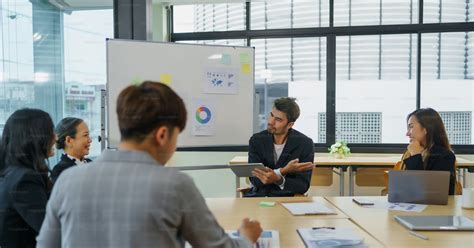 Meeting Of Asian Business People Who Are Committed To Work Creative