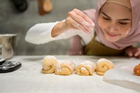 Young Beautiful Muslim Woman Is Baking In Her Kitchen Bakery And Coffee