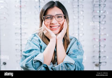 Happy Girl Modeling Glasses In An Optical Lens Store Portrait Of