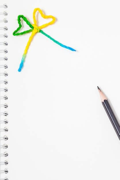 Premium Photo High Angle View Of Colorful String With Pencil On Blank