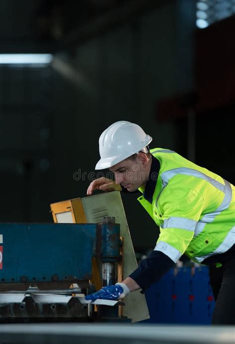 Two Engineers Testing Efficiency Of Solar Cell Panels Type With Led Light In Office At Night