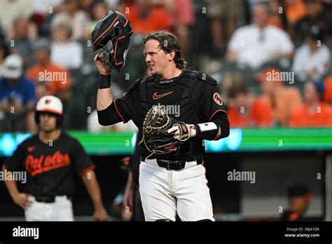 Baltimore Orioles Catcher Adley Rutschman Putting On His Helmet During