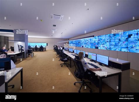 Group Of Security Data Center Operators Working In A Cctv Monitoring