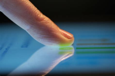 Close Up Of Hand Using Computer Touch Screen Premium Photo