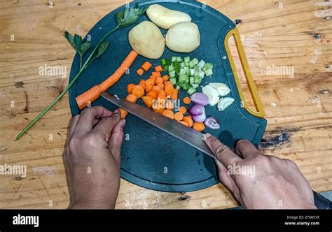 The Activity Of Cutting Vegetable Ingredients Using A Knife And Cutting