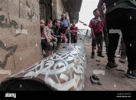 Palestinian Artist Bilal Khaled Draws On An Unexploded Ordinate In Gaza City On May 20 2021