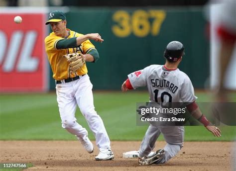 Mark Ellis Of The Oakland Athletics Tries To Turn A Double Play As