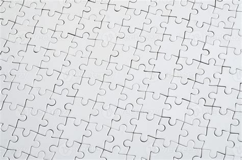 Close Up Texture Of A White Jigsaw Puzzle In Assembled Condition Top