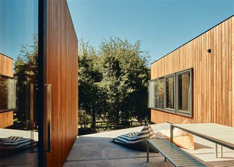 Landscape Responsive Design With Blackbutt Cladding And Concrete