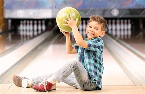 Premium Photo Cute Little Boy At Bowling Club