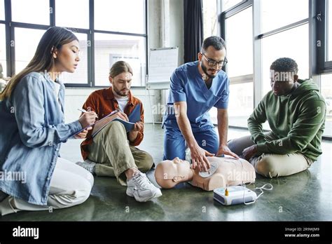 Cardiac Resuscitation Skills Healthcare Worker Applying Defibrillator