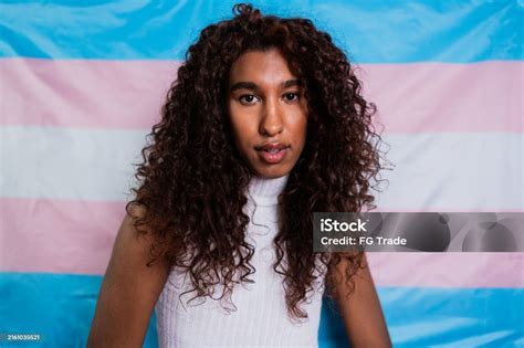 Portrait Of A Transgender Female With Transgender Flag In The
