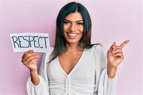 Young Latin Transsexual Transgender Woman Holding Respect Message Paper Smiling Happy Pointing