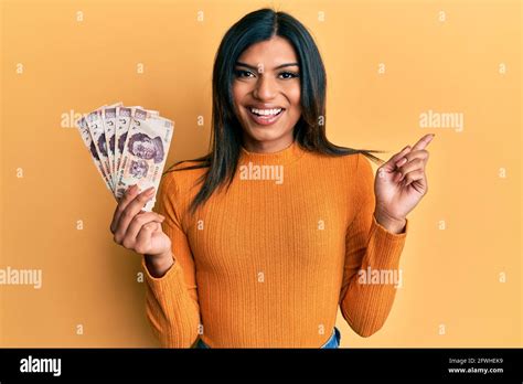 Young Latin Transsexual Transgender Woman Holding 500 Mexican Pesos