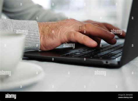 Closeup Of Senior Man Hands Using Laptop Cropped Side View Of Wrinkled Caucasian Older Hands