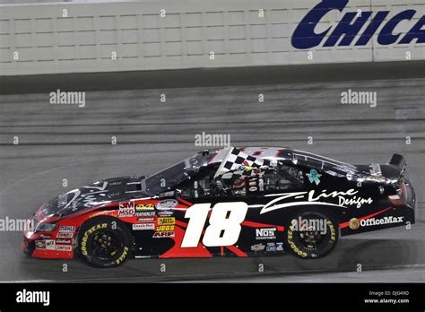 Kyle Busch Car 18 With The Checkered Flag After Winning The Nationwide