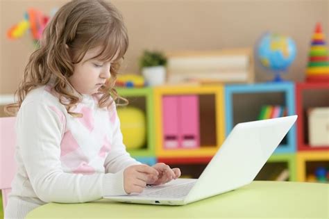 Premium Photo Portrait Of A Cute Girl Using Laptop