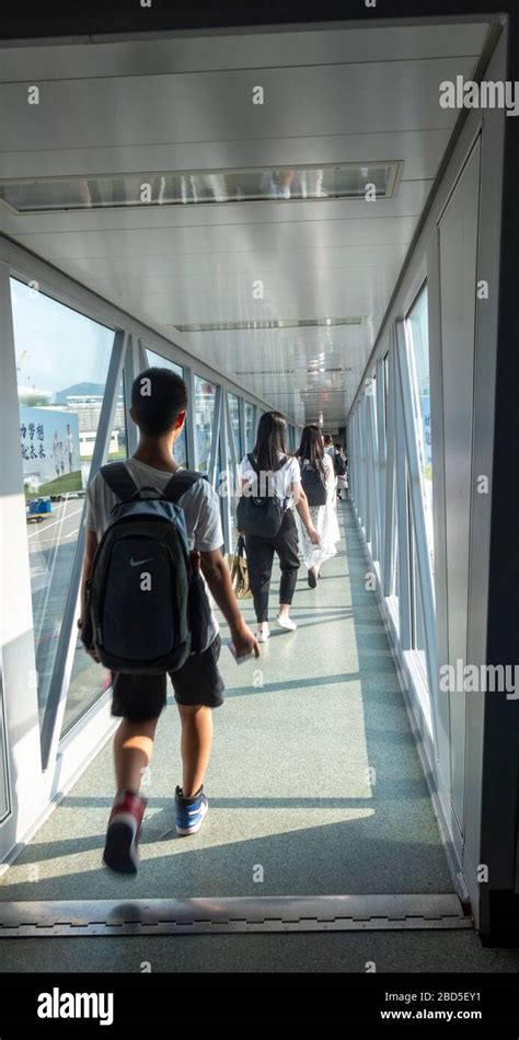 Passengers Boarding Plane Through Walkway Hangzhou Airport China