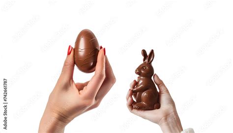 Cluster Of Womans Hand Embracing Chocolate Easter Egg And Chocolate Easter Bunny For A Merry