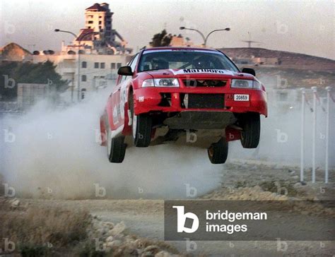 Image Of Kuwaiti Rally Driver Al Sarraf Jumps His Mitsubishi Car During Jordan International