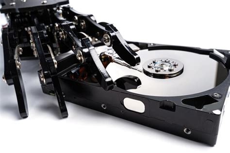 Premium Photo Real Robotic Hand With Hard Disk Drive Concepts Of Aipowered Data Protection Or