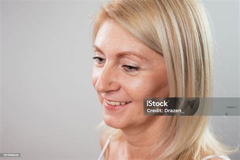 Portrait Of Beautiful Blonde Mature 55 Year Old Woman With Perfect
