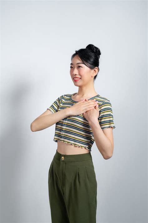 Touched Tender Smiling Asian Woman Gladly Receive Praises Hold Hands