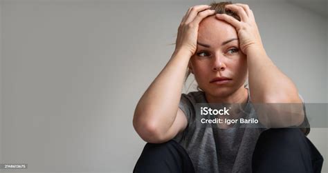 Portrait Of Downcast And Depressed Adult Woman At Home Depressed Female