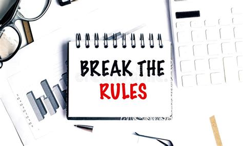 Notepad With Break The Rules Text On Desk With Charts Glasses
