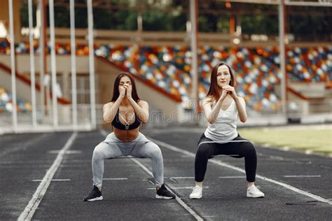 Two Sports Girls In A Uniform Training At The Stadium Stock Image Image Of Workout Wellness