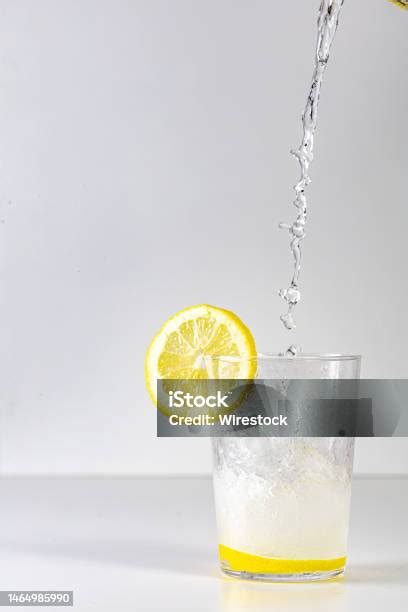 Closeup Of A Glass Of Mauresque Cocktail With A Lemon Slice Isolated On