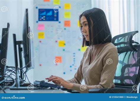 Asian Promt Engineer Develope Coding App With Software Data Sitting In