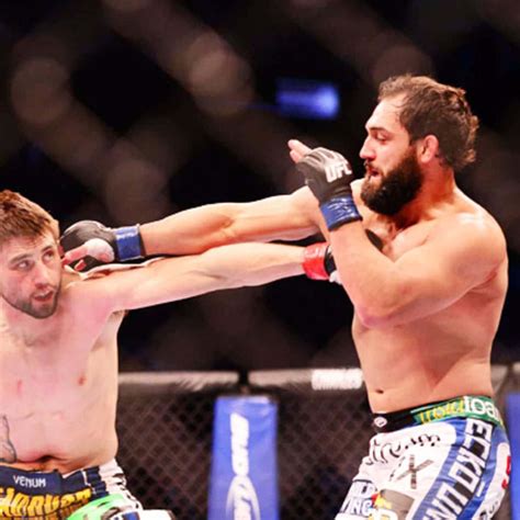 Download Mma Fighter Johny Hendricks Delivering A Long Jab Wallpaper