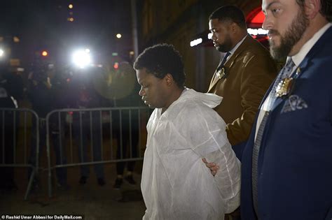 Homeless Man Carl Phanor Does Silent Perp Walk Wearing A Tyvek Suit After Being Arrested For