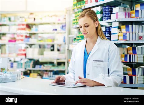 Pharmacy Woman Or Pharmacist With Digital Tablet To Order Medication