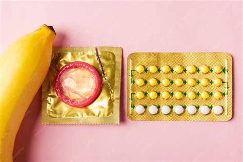 Premium Photo Condom On Wrapper Pack Banana And Contraceptive Pill