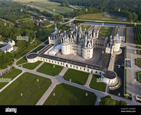 Aerial View Of A Magnificent Historic Castle From Above The Surroundings Are Green And Well