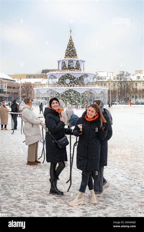 Beautiful Christmas Tree In A Big Cake With Snow And Beautiful Girls