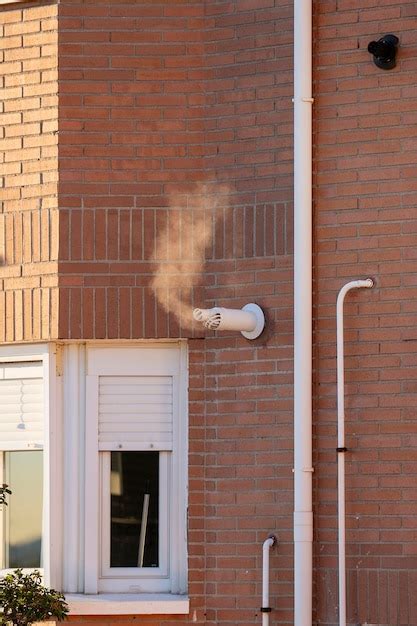 Premium Photo Small Chimney Releasing Water Vapor In A Chalet