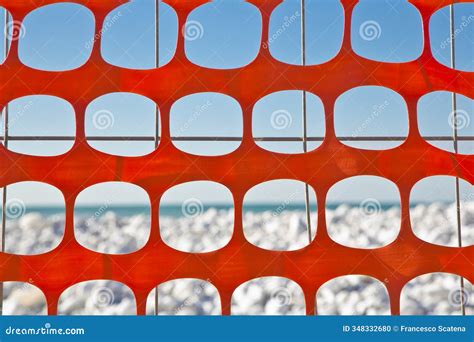 Perforated Safety Orange Plastic Grid To Delimit Construction Site