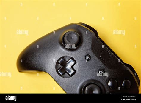 Black Joystick Gamepad Game Console On Yellow Colourful Trendy Modern Fashion Pin Up Background