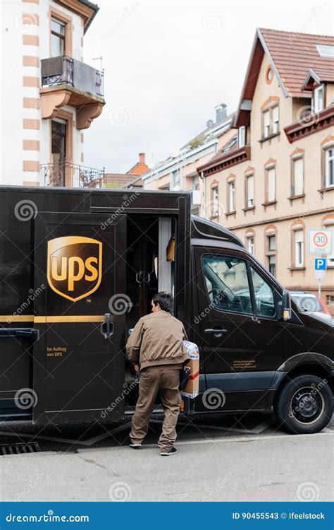 Ups United Parcel Service Delivery Van With Worker Driver Editorial